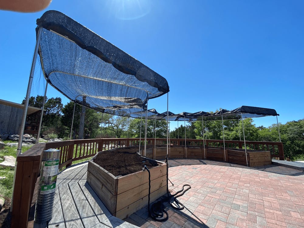 I turned an above-ground pool base into a roundish...